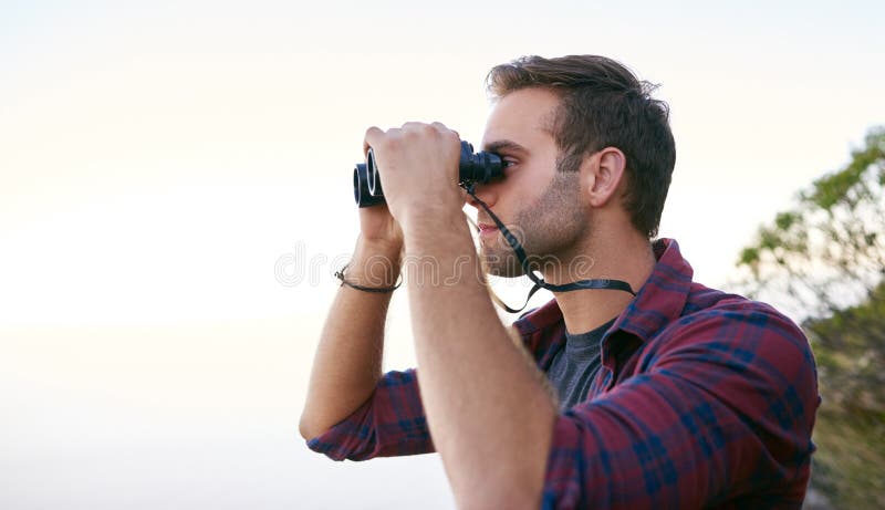 Young Man Looking into the Distance with Binoculars Stock Image - Image ...