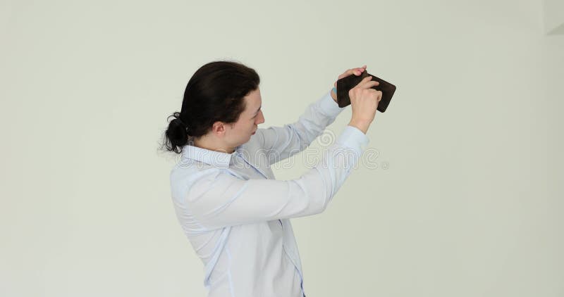 Young Man Looking at Empty Wallet on White Background Stock Video ...