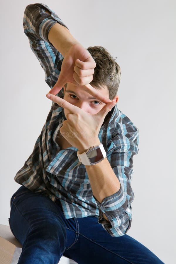 Young the Man Looking through a Frame of Fingers Stock Image - Image of ...