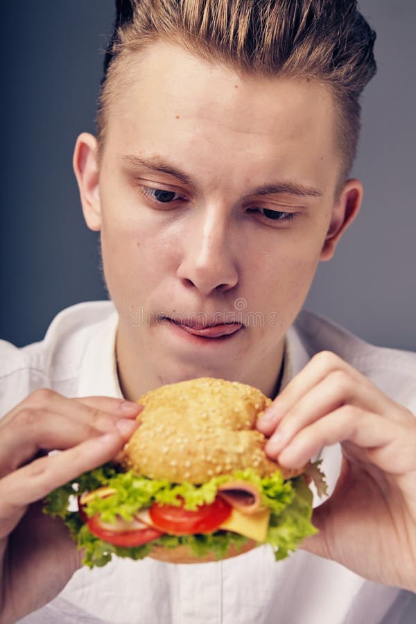 Young Man Looking at a Fresh Burger Stock Photo - Image of model, fresh ...