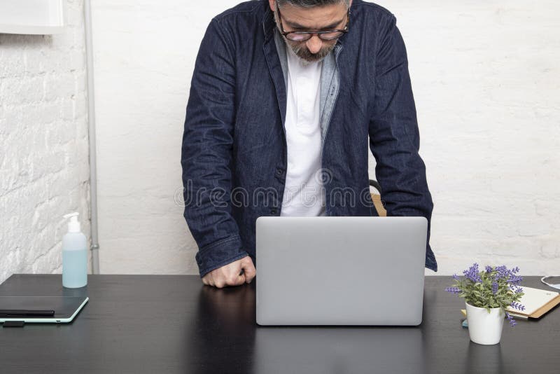 Young Man Looking at His His Laptop at Home. Work at Home Concept Stock ...