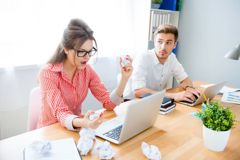 Young Man Looking at His Overworked Angry Partner with Problems Stock ...