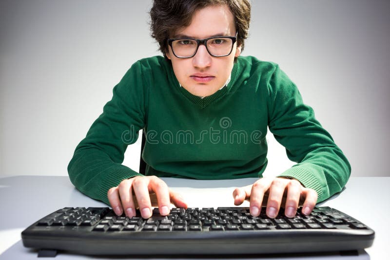 Young man looking intently stock image. Image of computer - 71771737