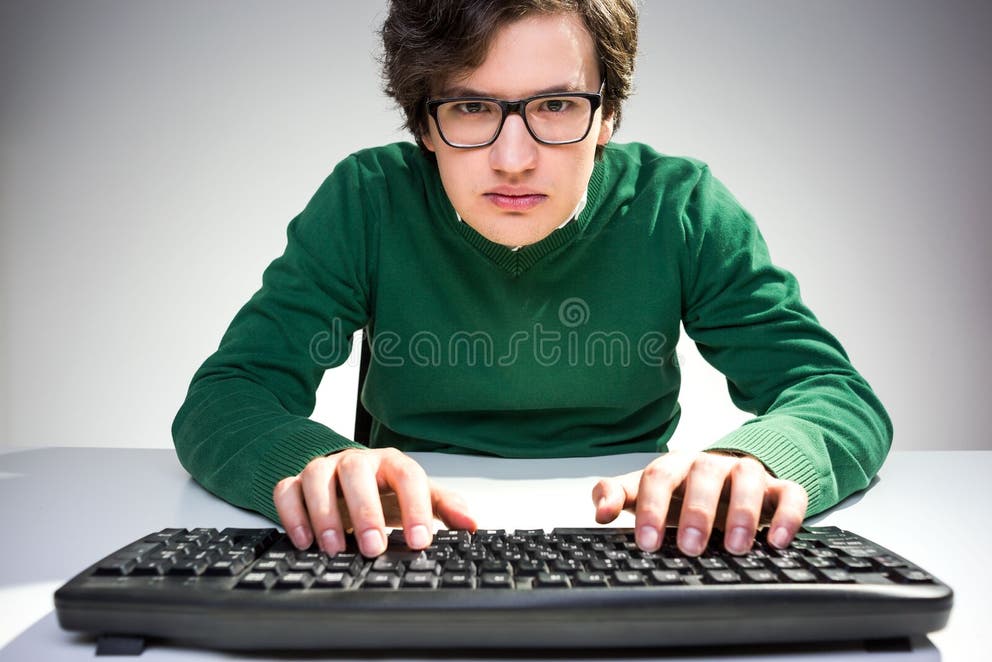Young man looking intently stock image. Image of computer - 71771737