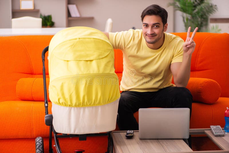 Young Man Looking after New Born at Home Stock Image - Image of family ...