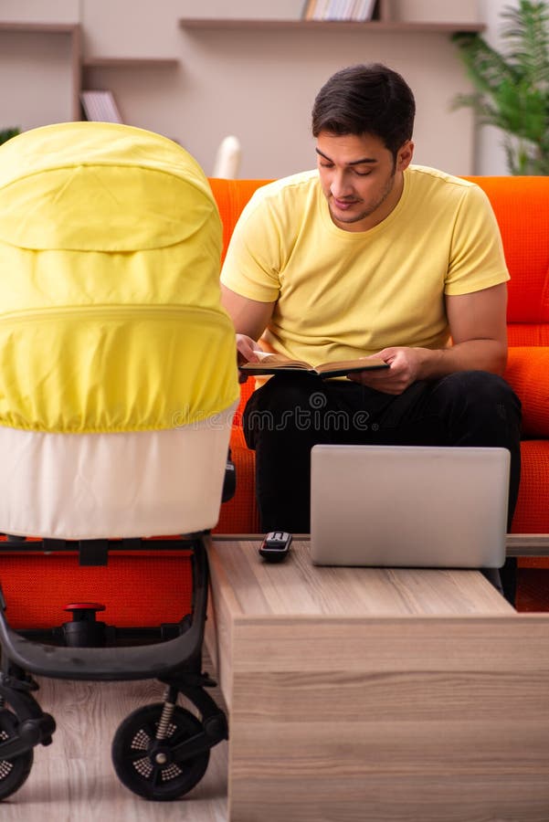 Young Man Looking after New Born at Home Stock Image - Image of book ...
