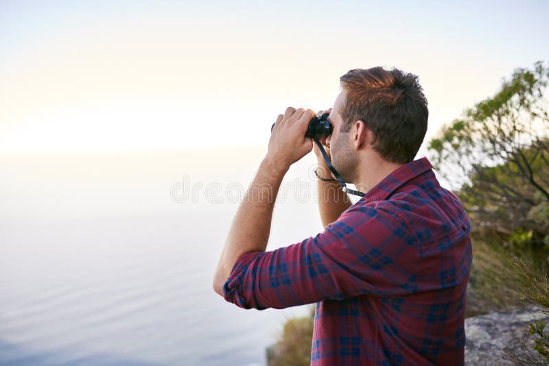 Young Man Looking Out at the Horizon with His Binoculars Stock Image ...