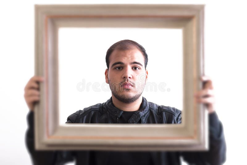 Young Man Looking through Picture Frame Stock Photo - Image of person ...