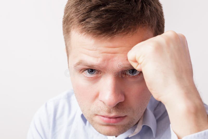 Young Man Looking Seriously Forward, Carefully Looking Stock Photo ...