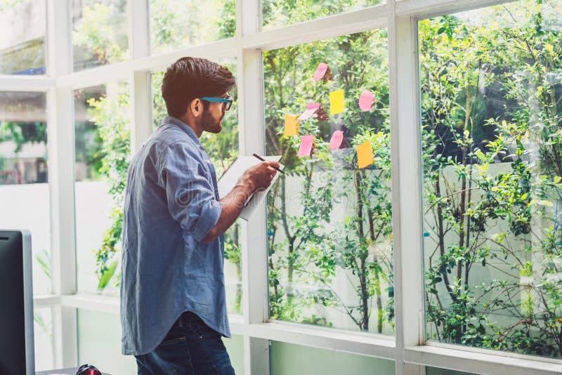 Young Man Looking Sticky Note Message Write Down Book Stock Photos ...