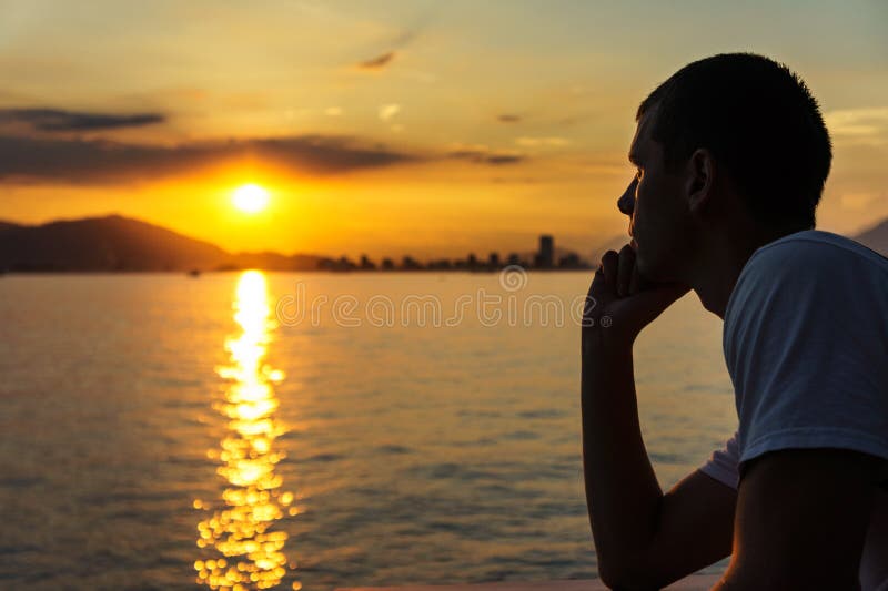 Young Man is Looking at the Sunrise Stock Image - Image of outdoor ...