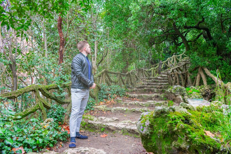 Young Man Looking Up Stairs in a Park Stock Photo - Image of pretty ...