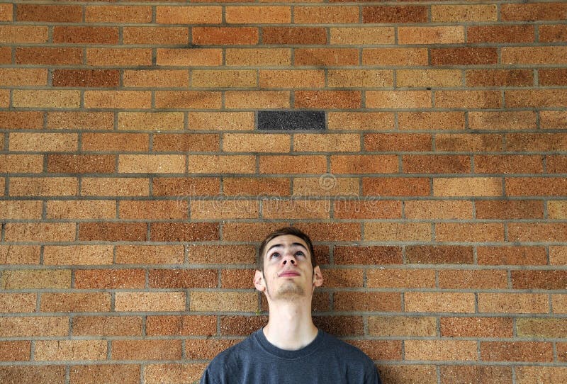Young man looks up above stock image. Image of look, alone - 15984349