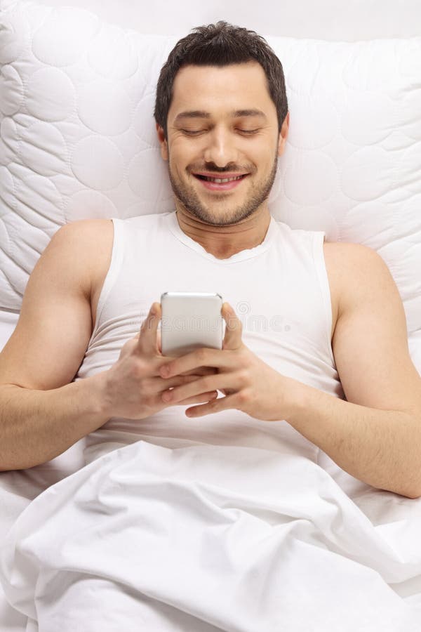 Young man lying in bed stock image. Image of lying, soft - 100784839