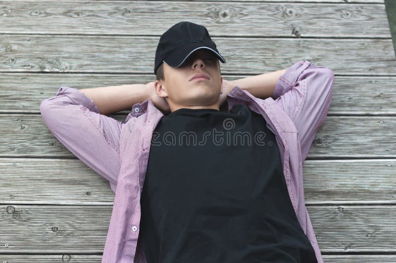 Young Man Has a Rest Lying on the Boards Stock Photo - Image of leisure ...