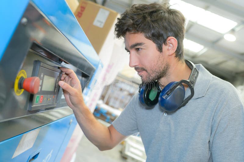 Young man with machine stock image. Image of buttong - 83391081