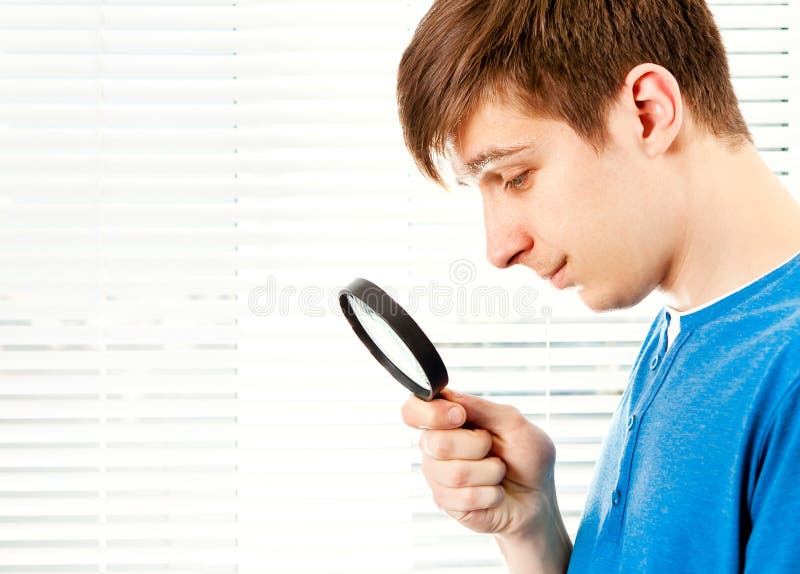 Young Man with a Magnifying Glass Stock Image - Image of young ...