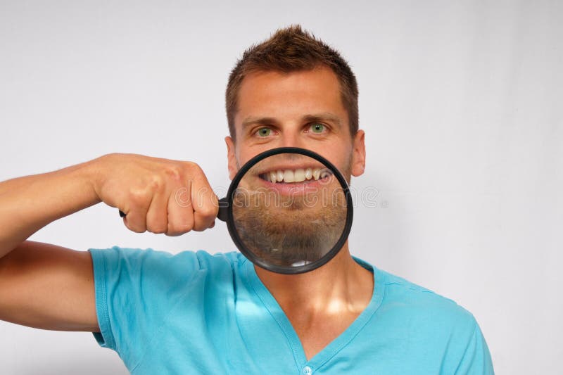Young Man with a Magnifying Magnifier Stock Photo - Image of people ...