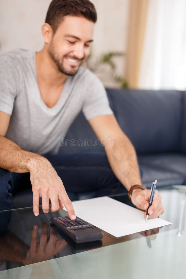 Young Man Making Calculation Stock Image - Image of document, profit ...