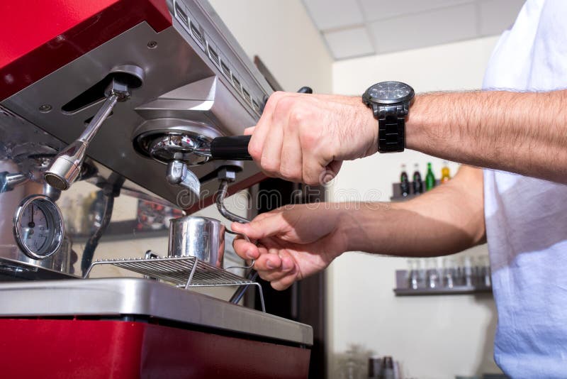 Young man making coffee stock image. Image of metallic - 141586105