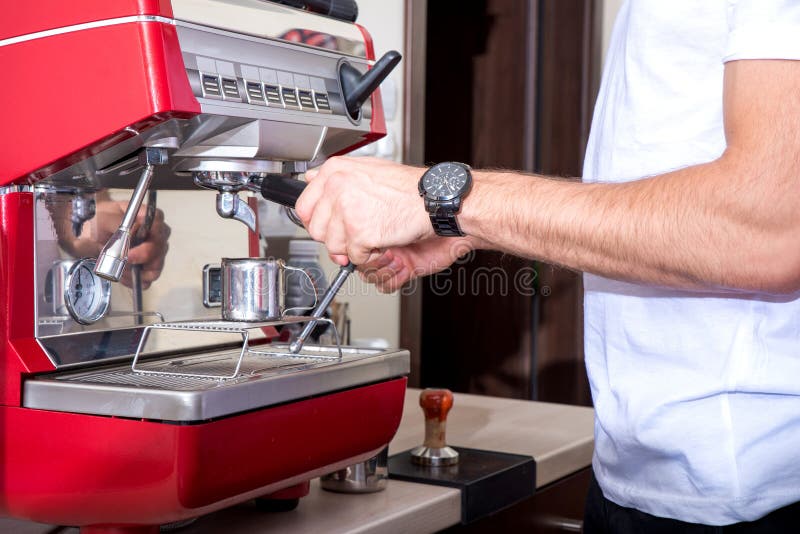 Young man making coffee stock image. Image of automat - 93970131