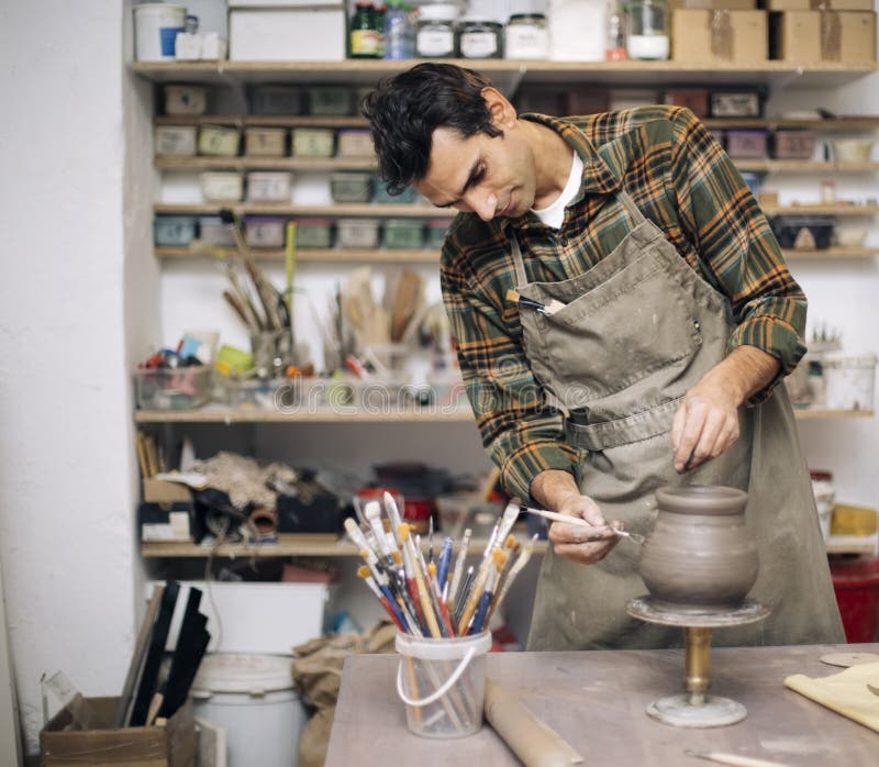 Young Man Making Pottery in Workshop Stock Photo - Image of color ...