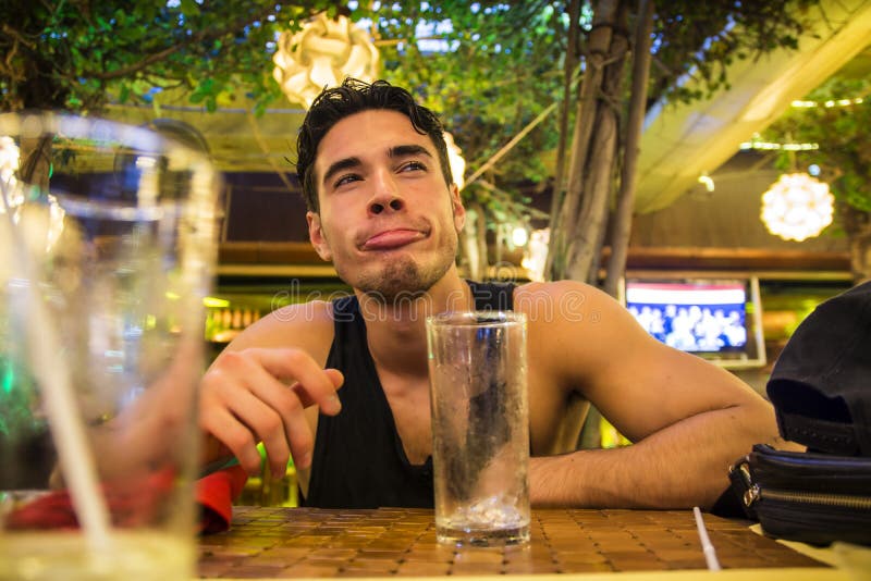 Young man making faces stock image. Image of grimace - 85977303