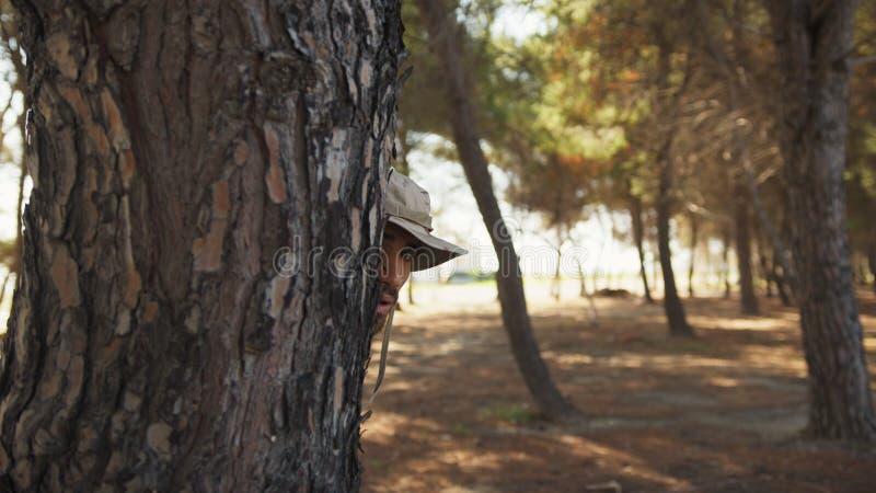 Scared Soldier Hides Behind a Trunk of Tree from the Enemy S Imminent ...