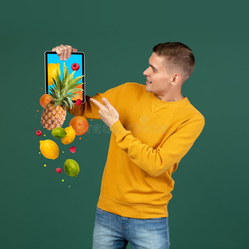 One Young Caucasian Man Holding His Picture Isolated Over Green Studio ...