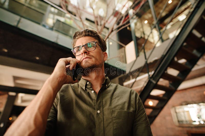 Young Man Making a Phone Call Stock Photo - Image of office, phone ...