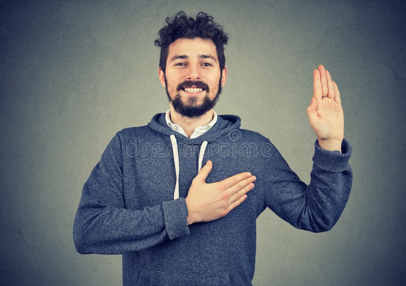 Young man making a promise stock photo. Image of business - 121497852