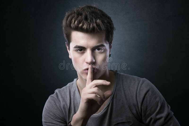 Young Man Making Silence Gesture Stock Image - Image of fashion ...