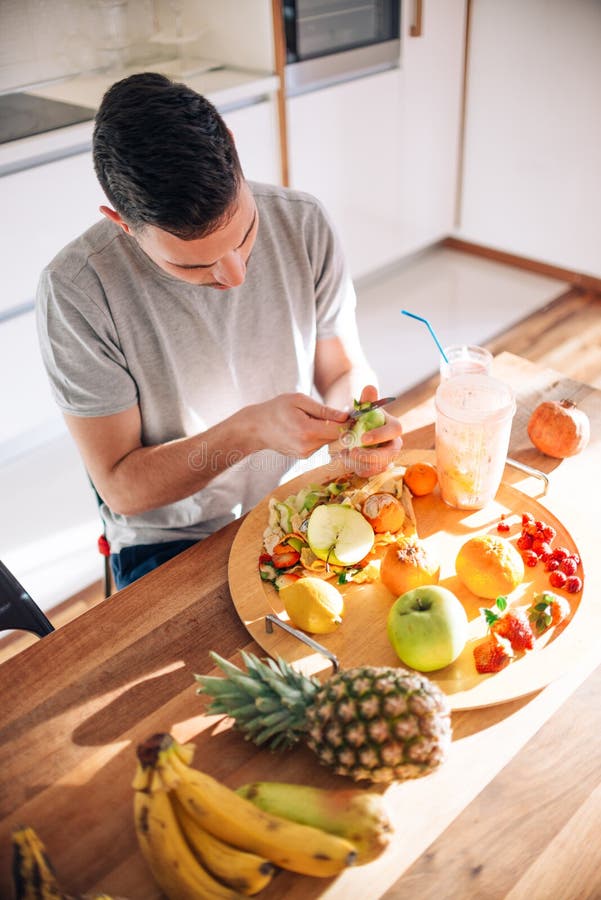 Young Man Making Smoothie on a Table on a Sunny Day Stock Image - Image ...