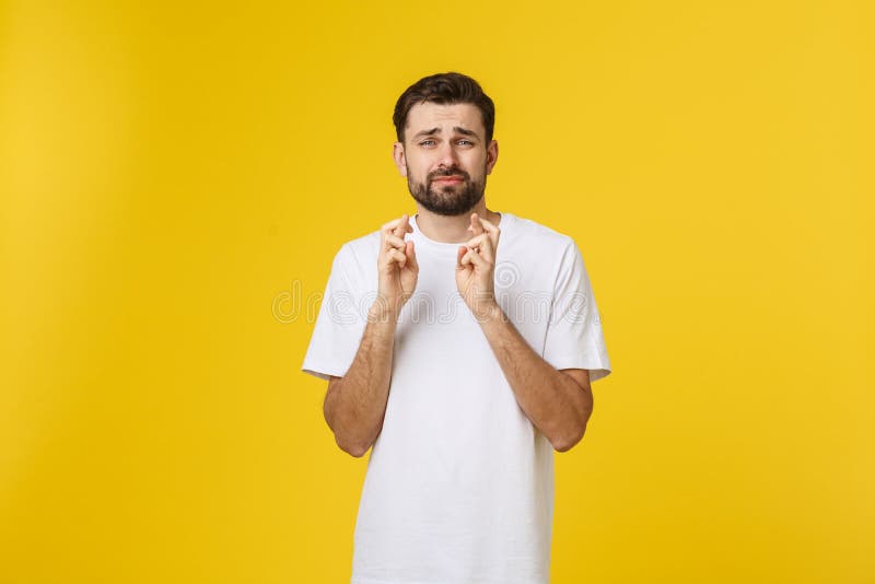 Young Man Making a Wish Isolated on Yellow Background Stock Image ...
