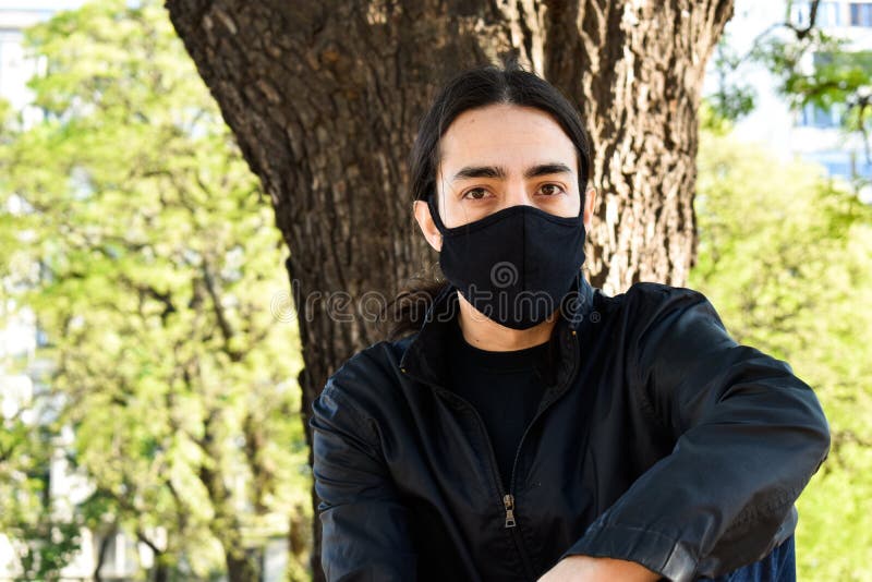 Young Man with a Mask at the Park Stock Image - Image of dust, alone ...
