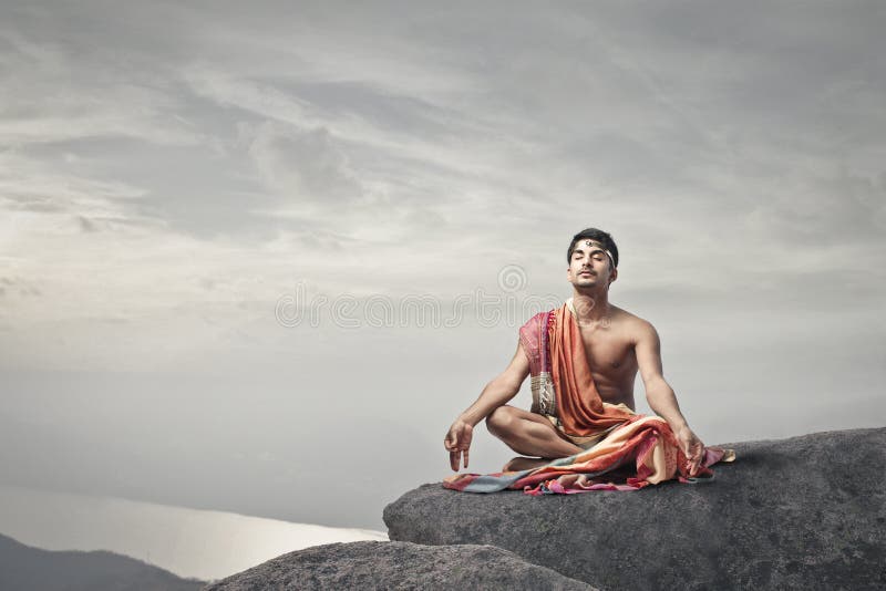Young Man Meditating Rock Wearing Indian Cloths Stock Photos - Free ...