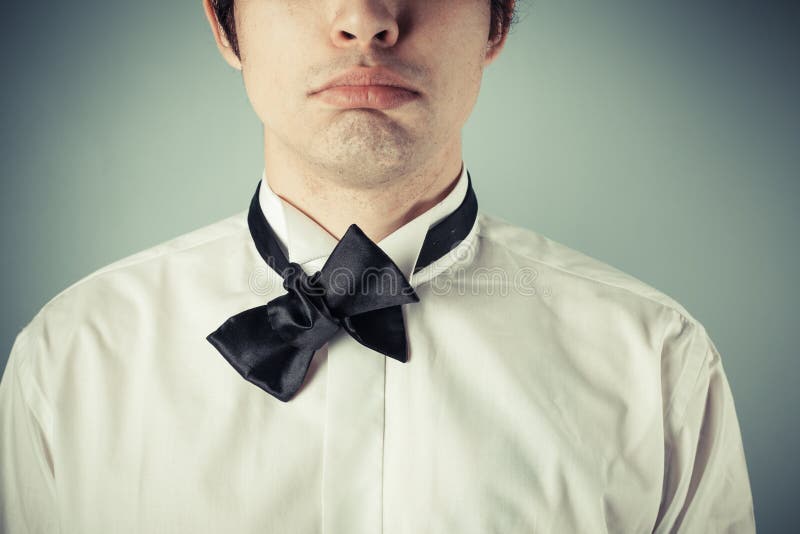 Young Man with Messy Bow Tie Stock Image - Image of style, wealthy ...