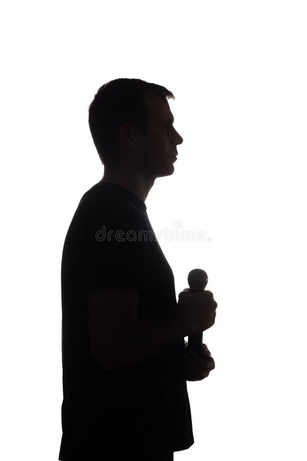 Young Man with Microphone in His Hands - Silhouette Stock Image - Image ...