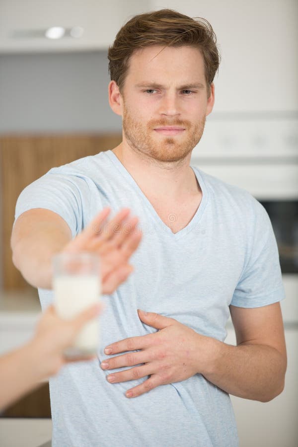 Young Man with Milk Allergy Refusing Glass Stock Photo - Image of ...