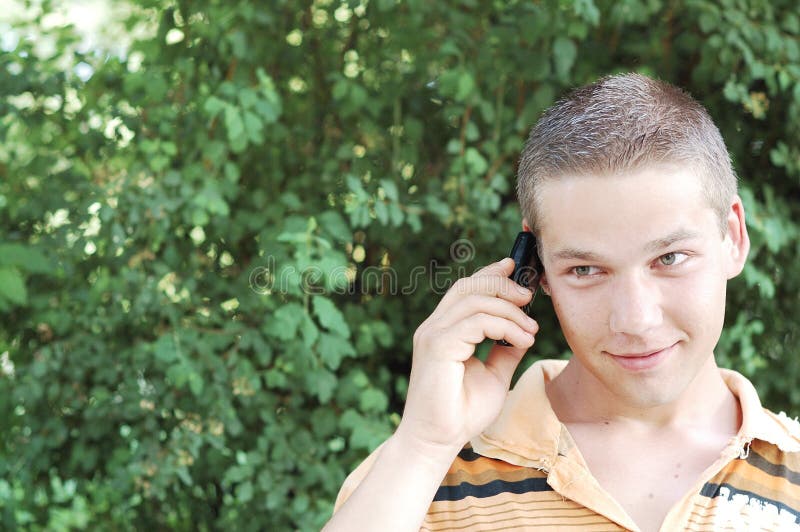 Young Man with Mobile Phone Stock Image - Image of cell, teen: 5580443