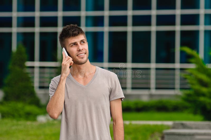 Young man and mobile phone stock image. Image of confident - 41802827