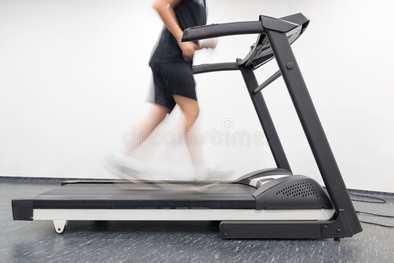 Young Man in Motion on a Treadmill in the Gym Stock Image - Image of ...