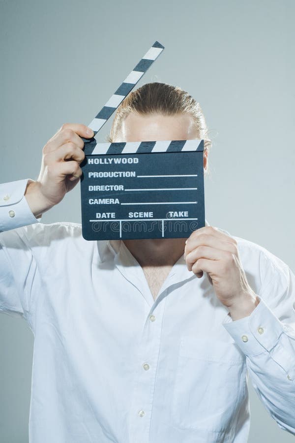 Young Man with Movie Clapper Stock Photo - Image of scene, chalkboard ...