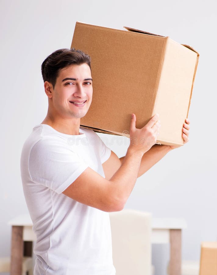 Young Man Moving Boxes at Home Stock Image - Image of moving, delivery ...