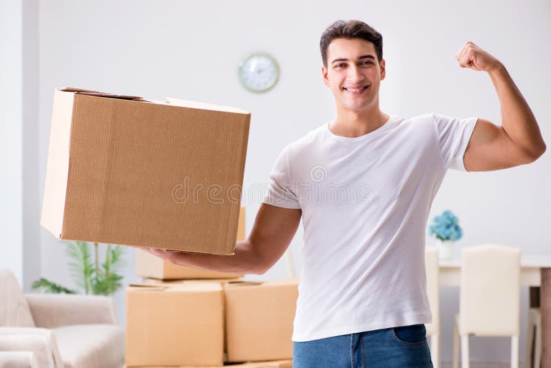 The Young Man Moving Boxes at Home Stock Photo - Image of male, house ...