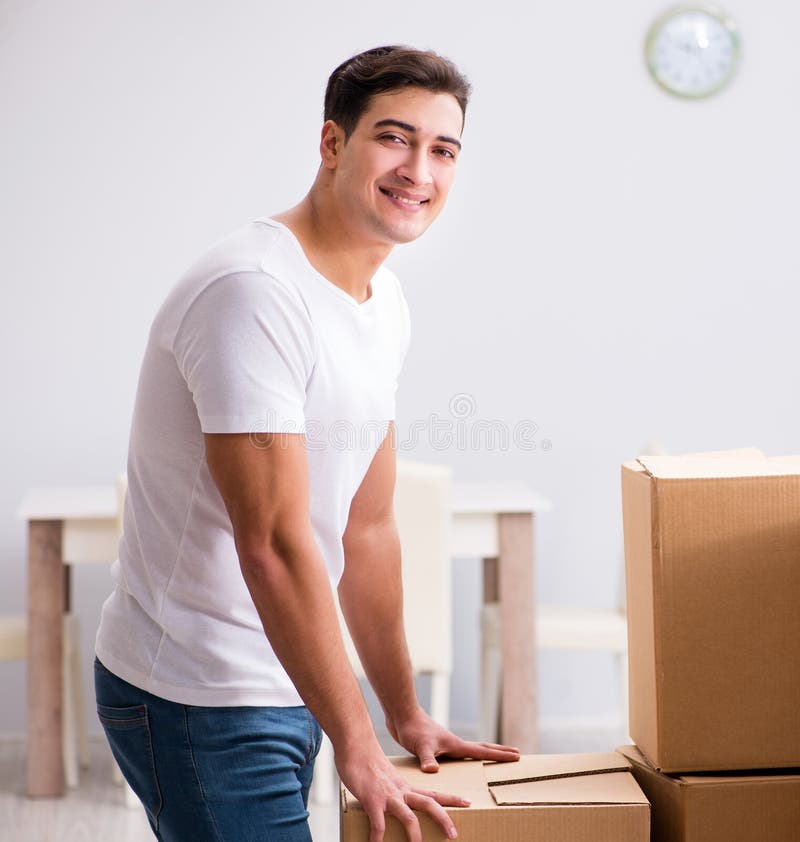 Young Man Moving Boxes at Home Stock Photo - Image of courier, helmet ...