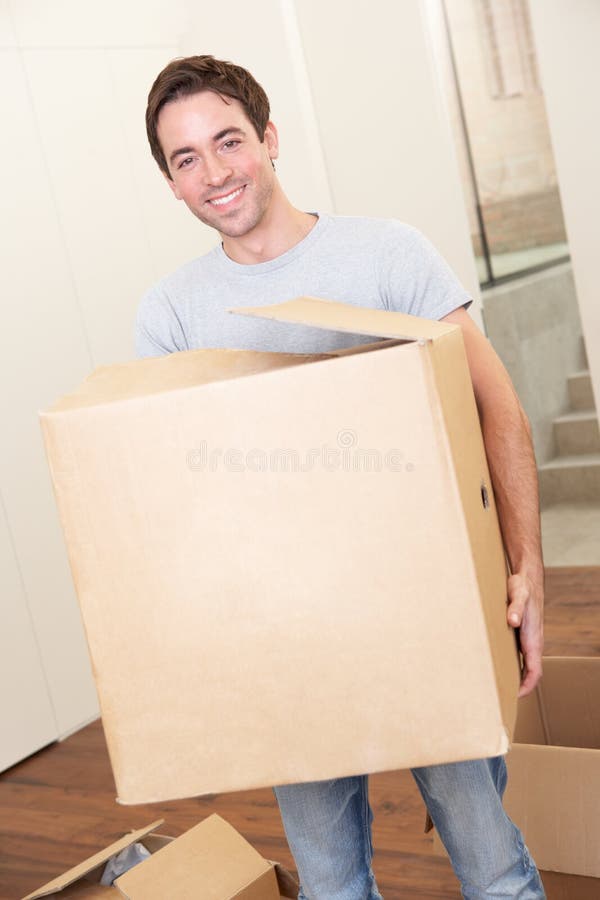 Young Man on Moving Day Carrying Cardboard Box Stock Image - Image of ...