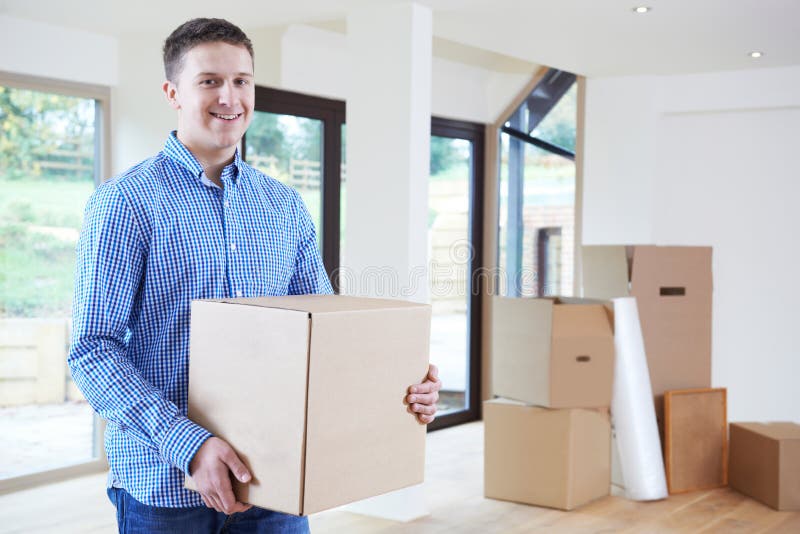 Young Man Moving into New Home Stock Photo - Image of opening, ladder ...