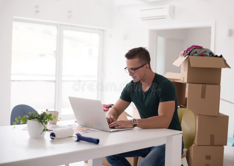 Young Man Moving in a New Home Stock Image - Image of adult, happy ...