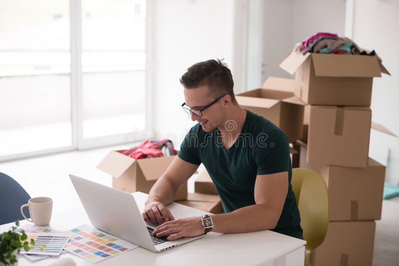 Young Man Moving in a New Home Stock Photo - Image of estate, interior ...